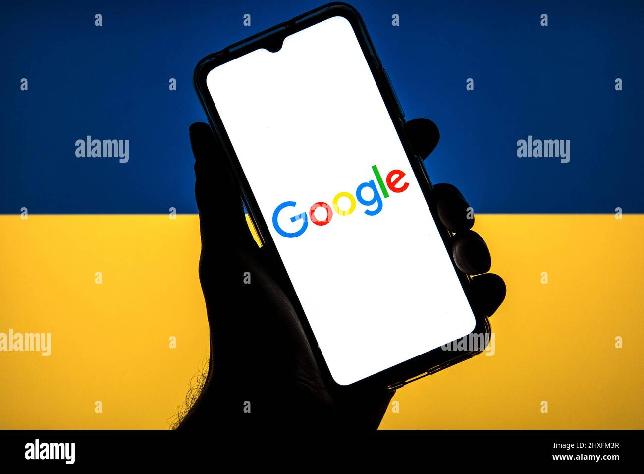 In this photo illustration a Google logo seen displayed on a smartphone ...