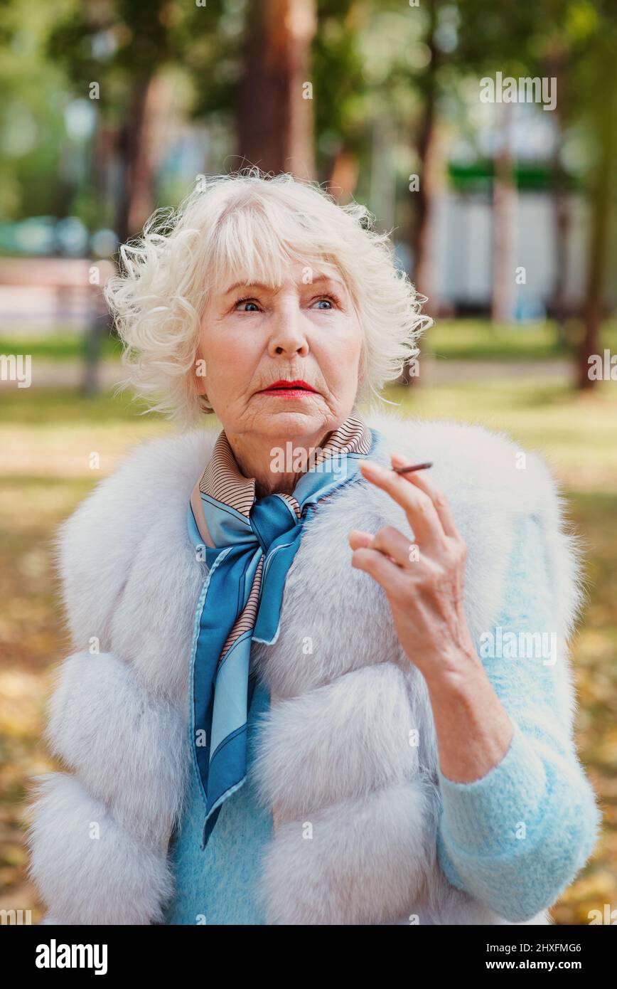 Older woman fur coat hi-res stock photography and images - Alamy