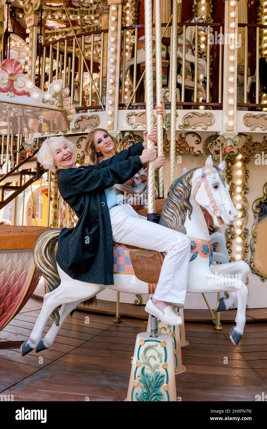 portrait of senior woman with daughter spending nice time together at ...