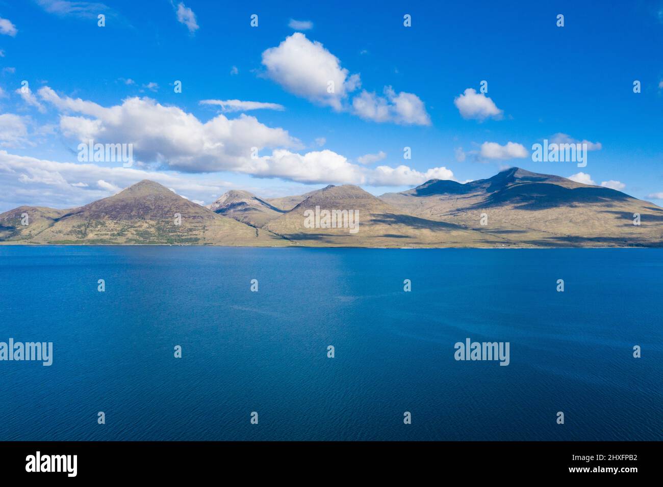 Scottish mountains with sea water on a sunny day, aerial shot, Isle of ...