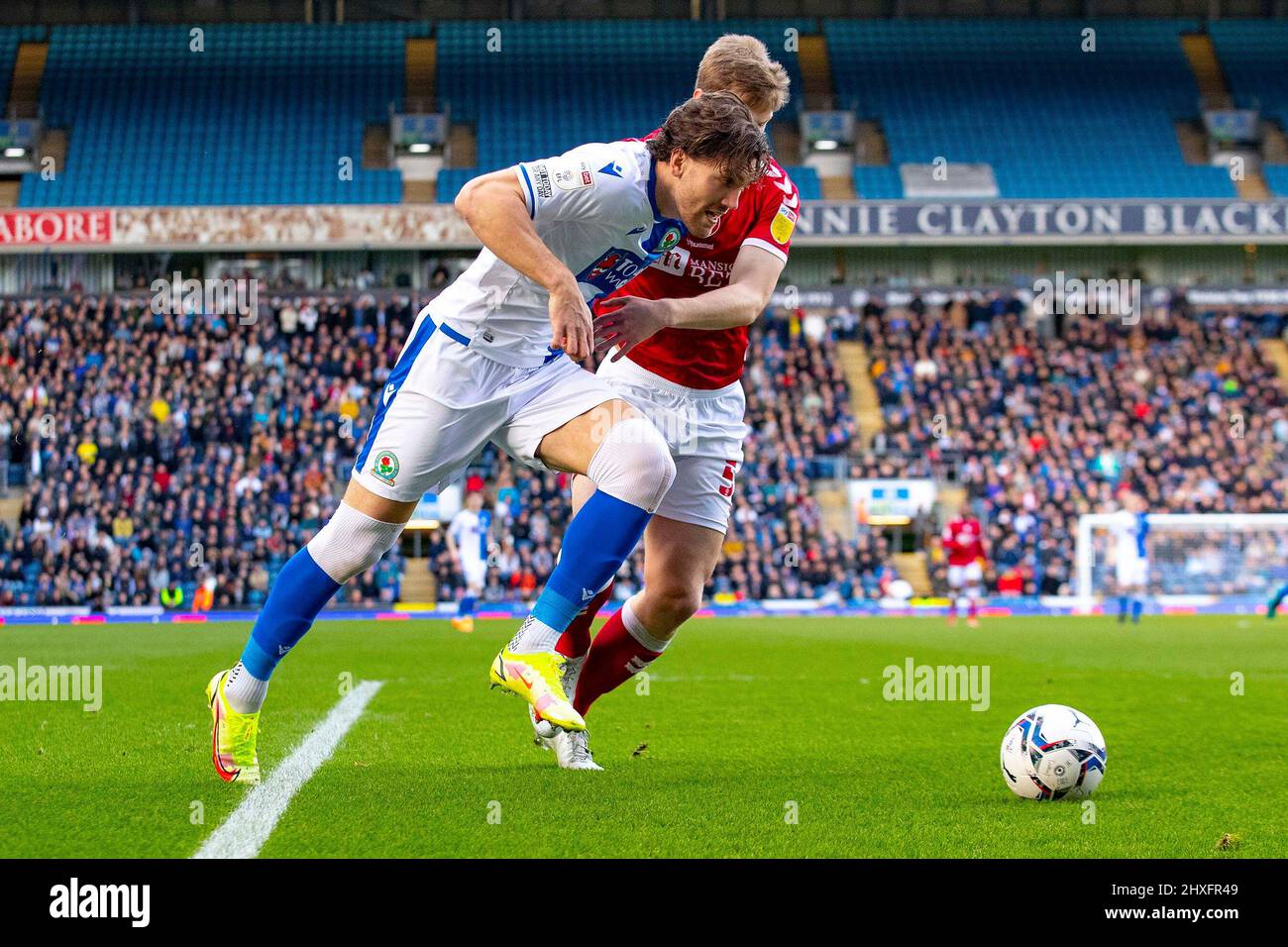 Sam Gallagher #9 of Blackburn Rovers tackled byRob Atkinson #5 of ...