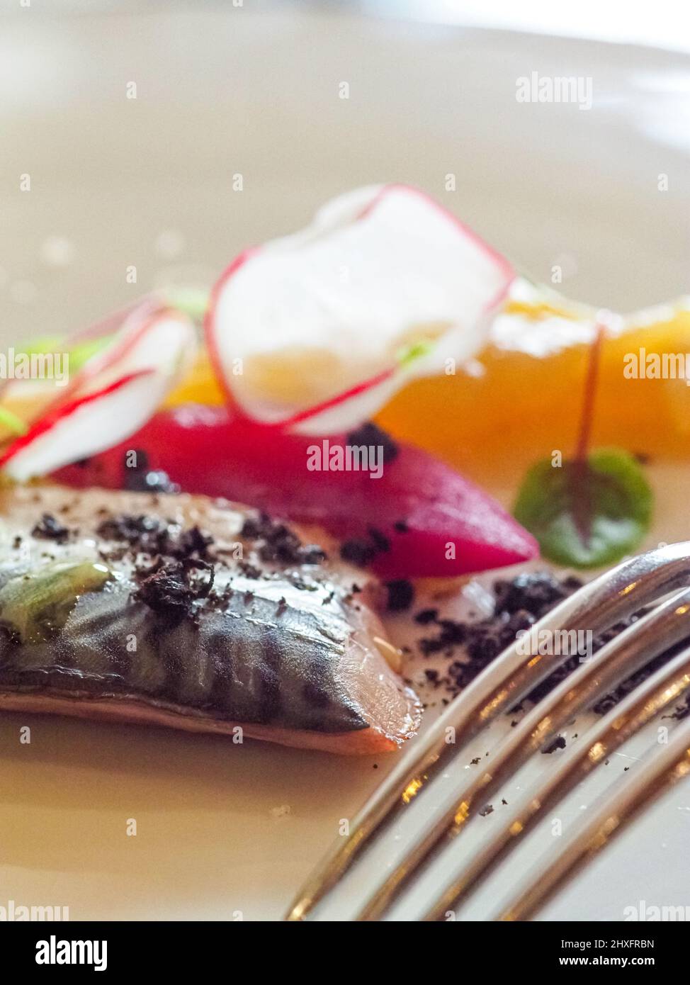 mediterranean raw sea bass grilled fish filet, steamed potato, black ...