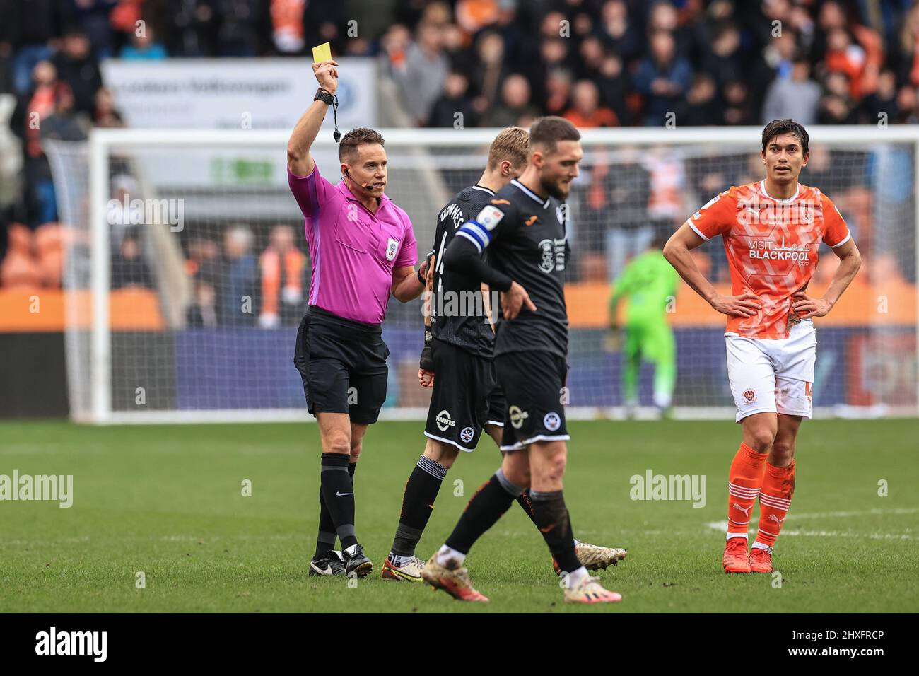 referee Steve Martin gives Flynn Downes #4 of Swansea City a yellow ...