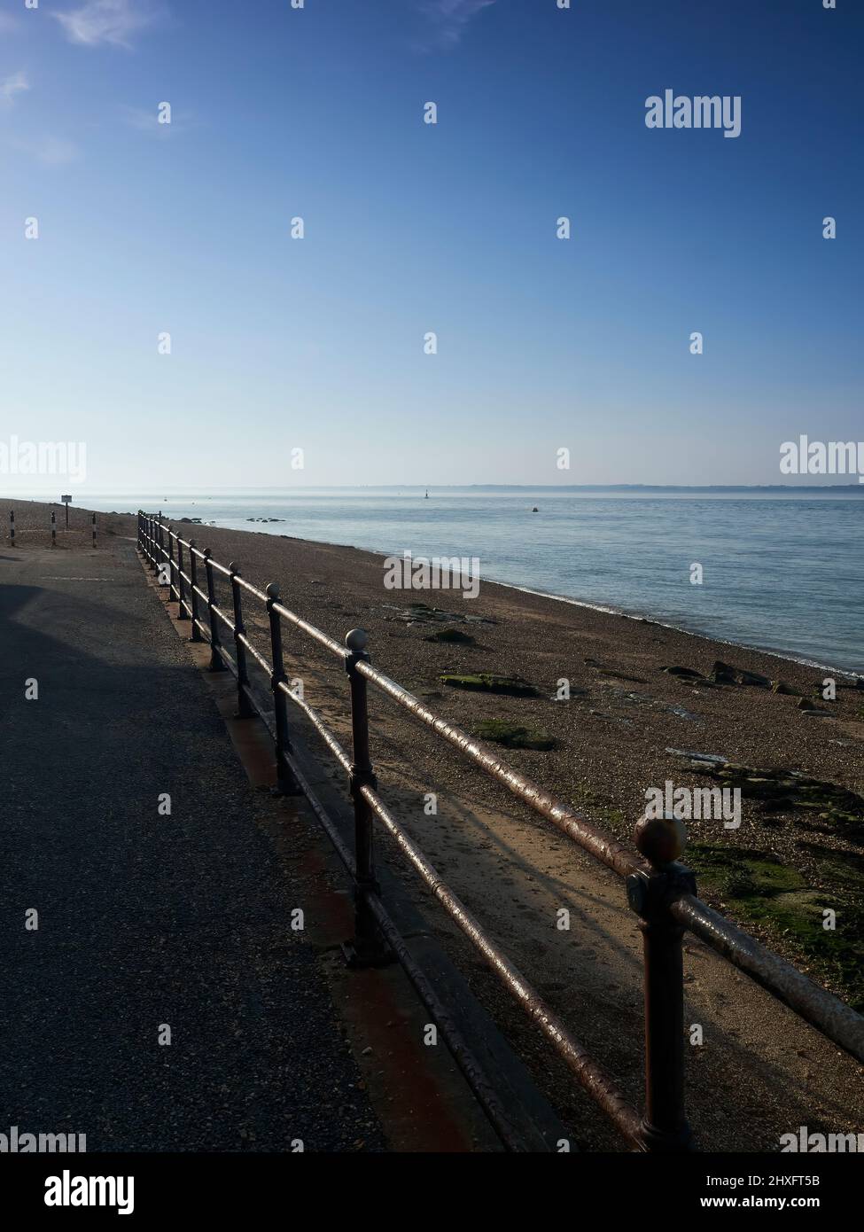 Bleached, dramatic view across the Solent from the Isle of Wight, over ...