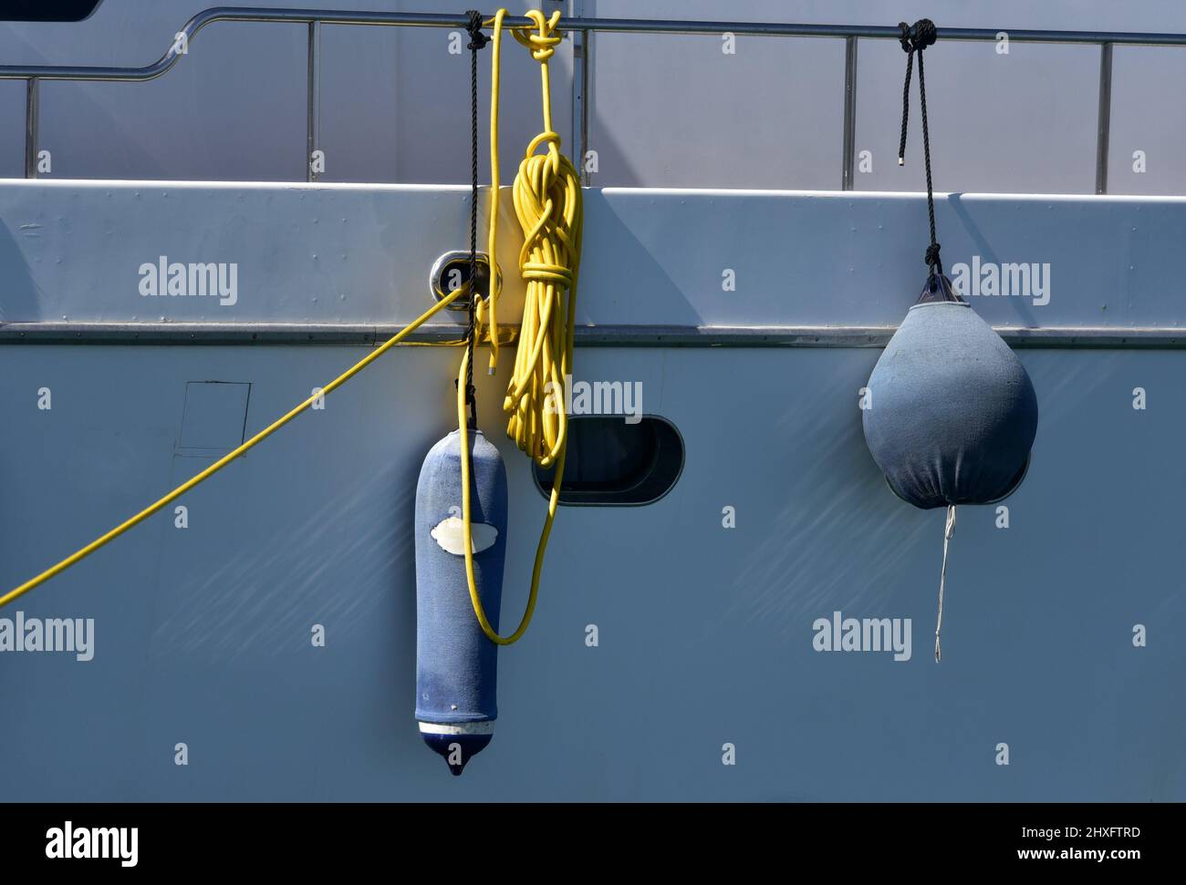Greek sailing boat starboard with heavy duty balloon fenders and ropes ...