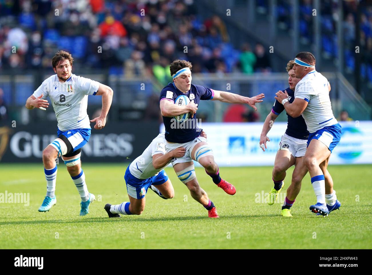 Scotland's Rory Darge is tackled by Italy's Callum Braley during the ...