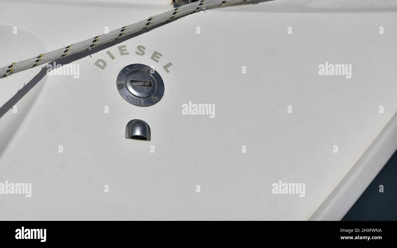 Polished stainless steel diesel deck plug on a sailing boat carbon ...