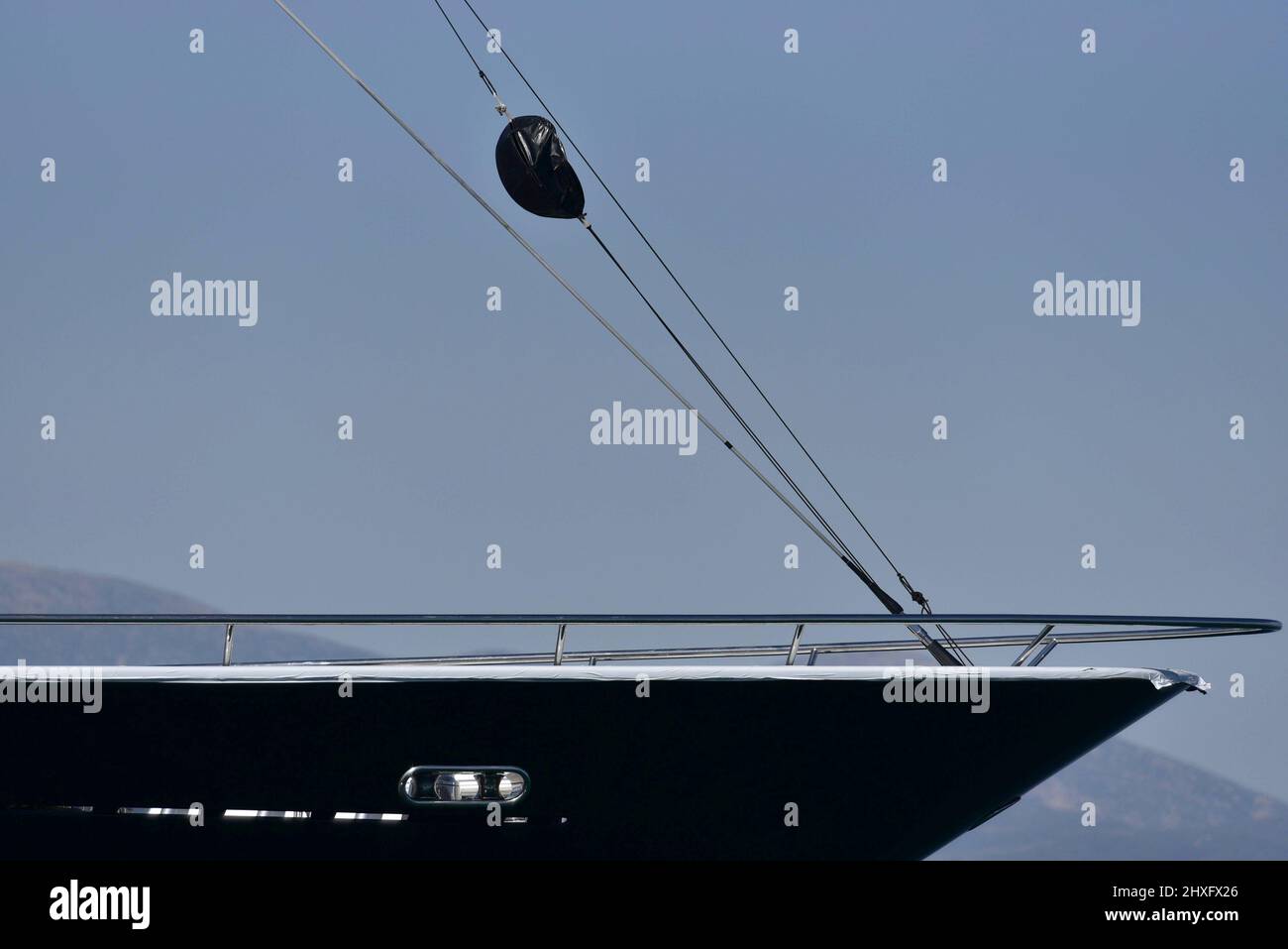 Luxury sailing charter boat bow with a stainless steel railing and a ...