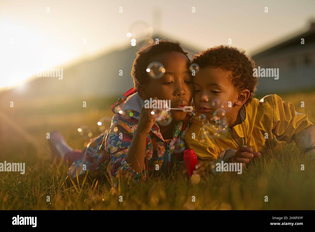 Siblings and the best of friends. Shot of a brother and sister lying on ...