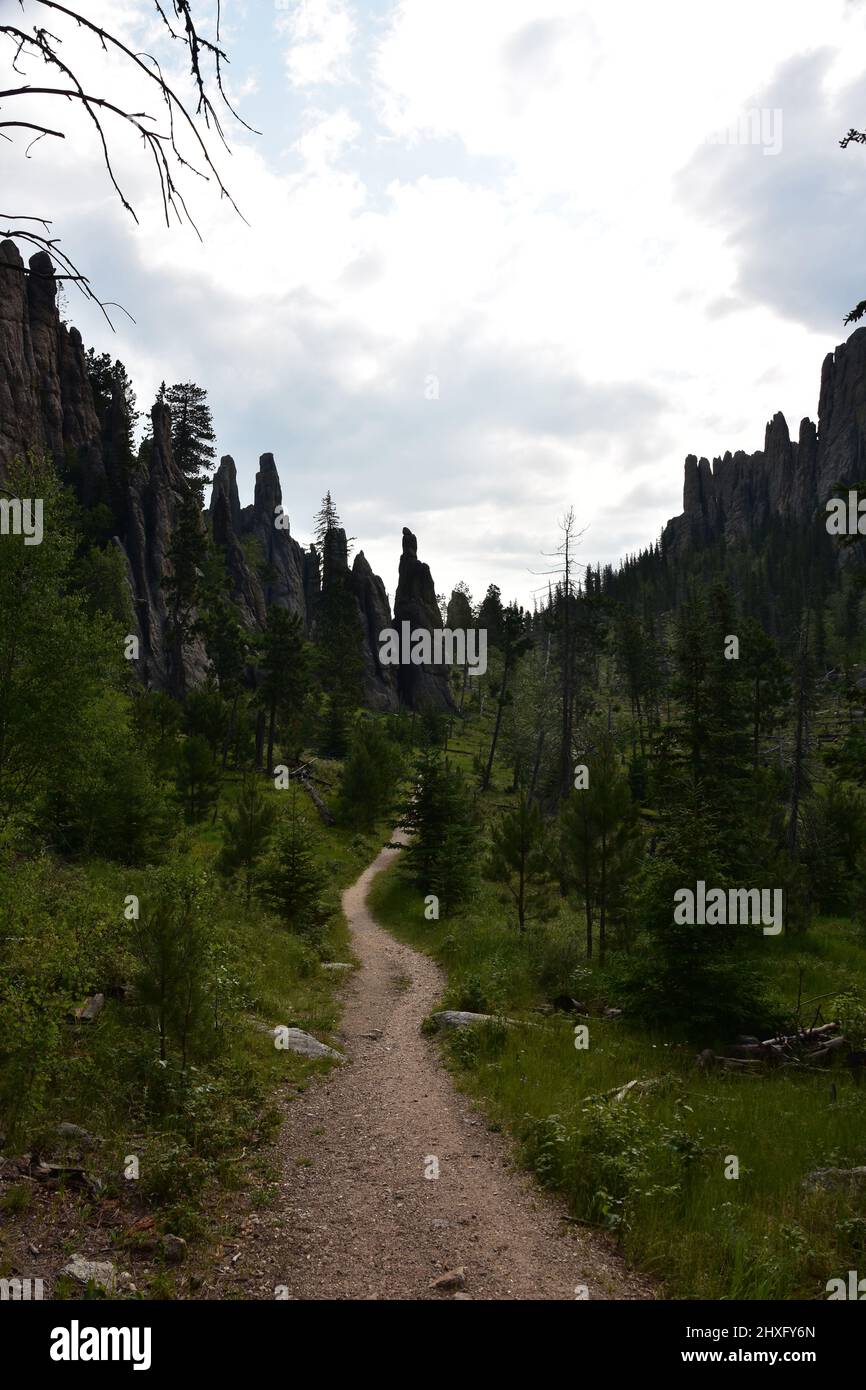 Packed dirt hiking trail up to unusual towering pinnacle rocks Stock ...