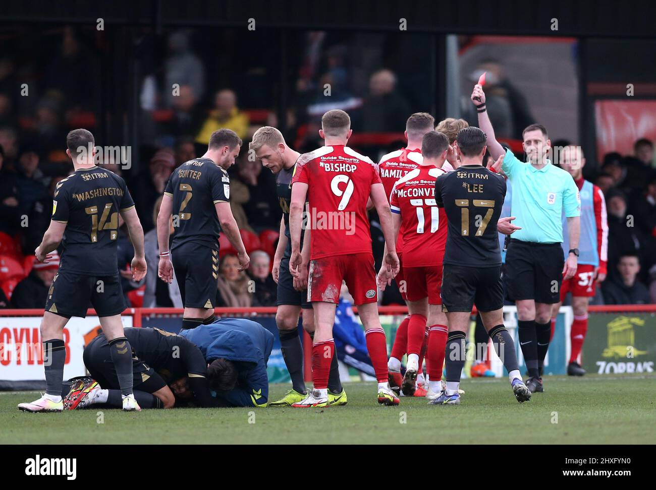 Referee Simon Mather shows Accrington Stanley's Tommy Leigh a red card ...