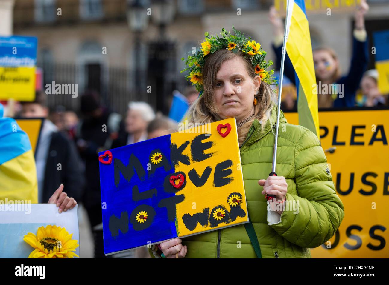 London, UK. 12 March 2022. A demonstrator shows solidarity with the ...
