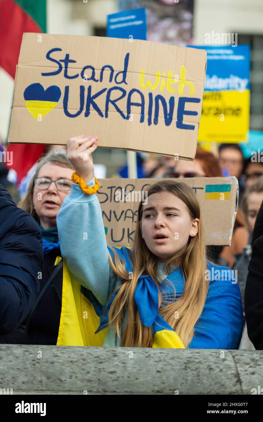 London, UK. 12 March 2022. A demonstrator shows solidarity with the ...