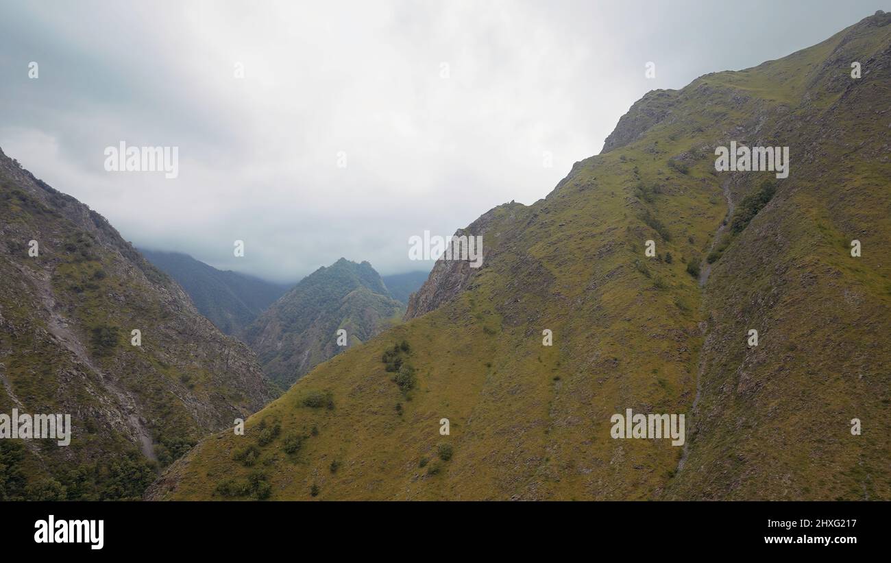Aerial view of a picturesque gorge on heavy cloudy sky background ...
