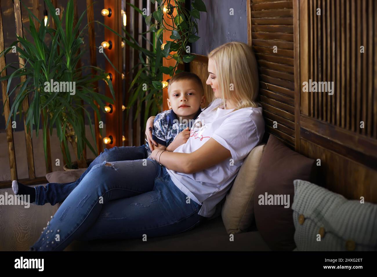 Funny active family of young adult parents and cute small children ...