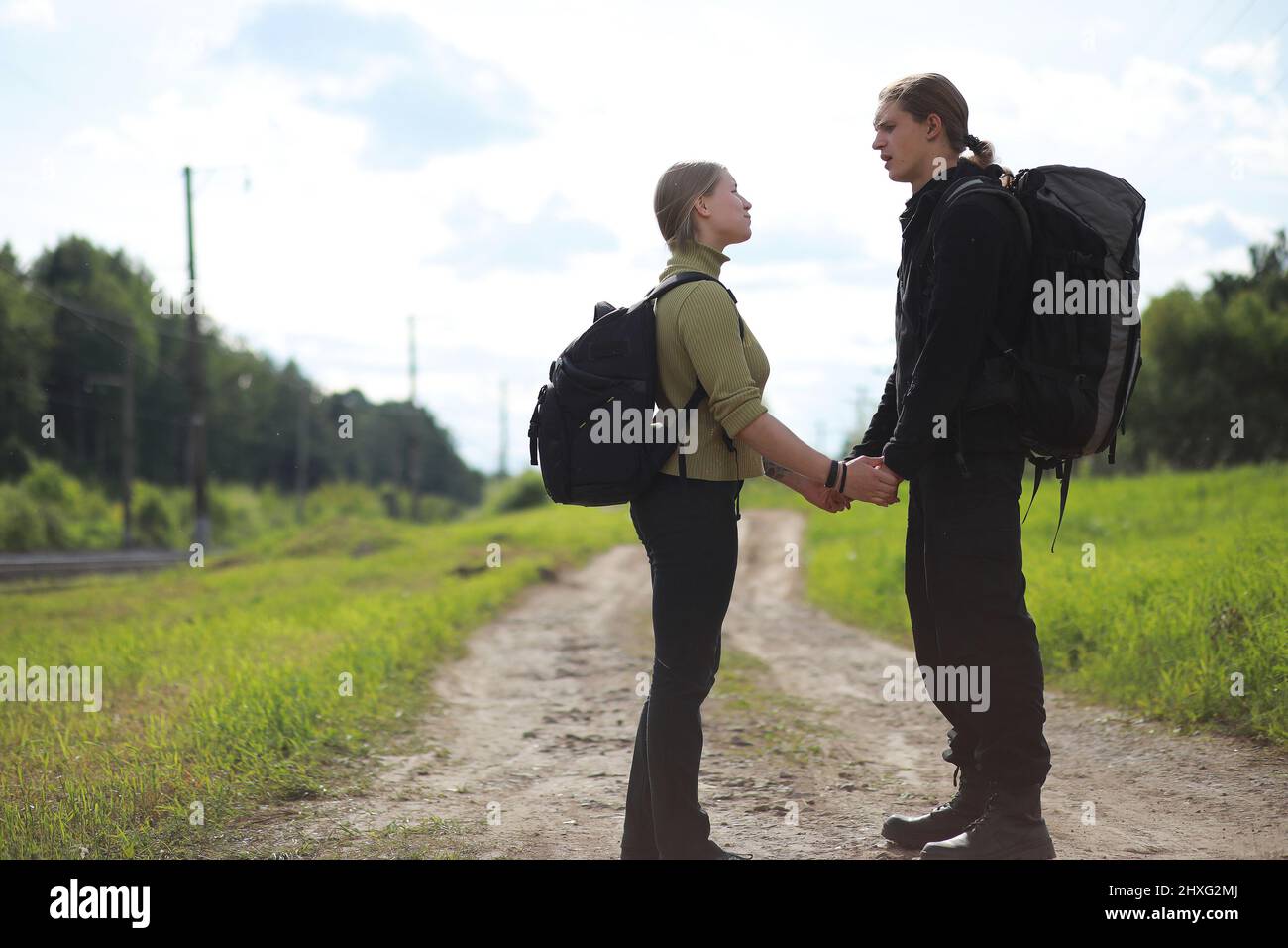 Traveling with a backpack on foot and hitchhiking Stock Photo - Alamy