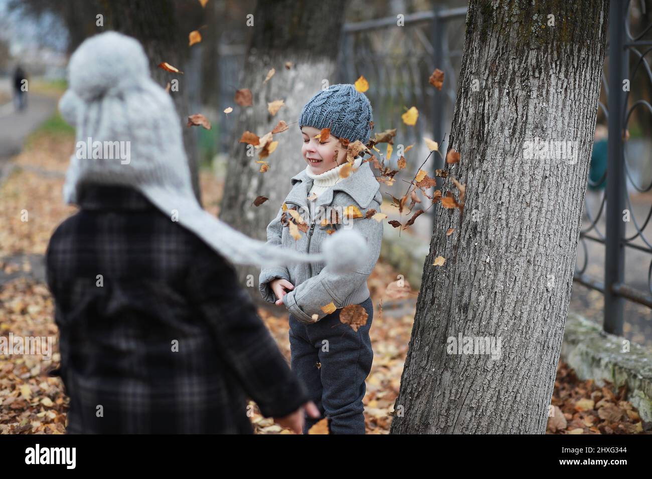 Children walk in the autumn park in the fall Stock Photo - Alamy
