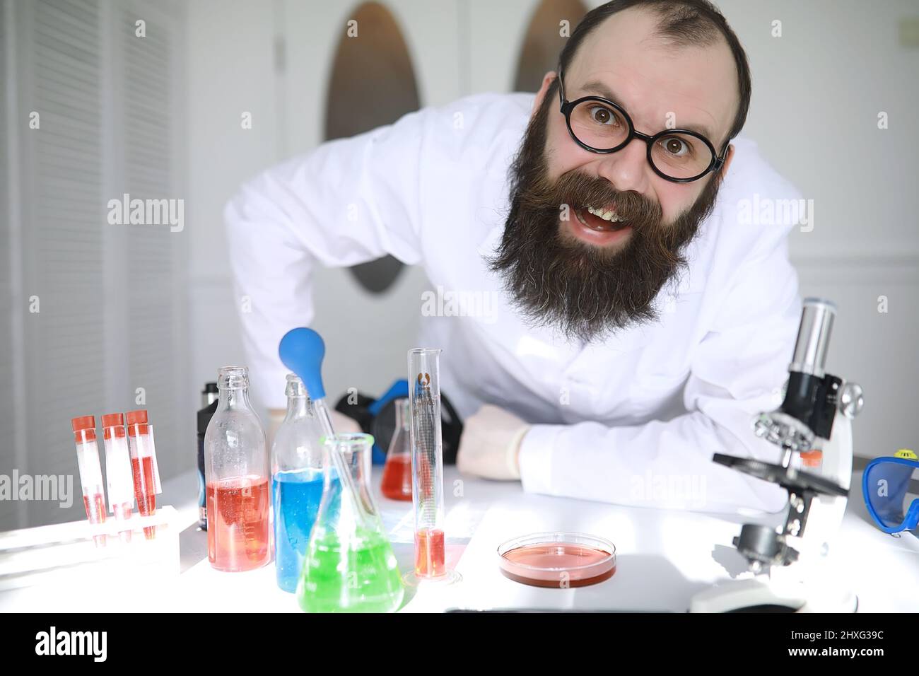 Chemist crazy. A mad scientist conducts experiments in scientific ...