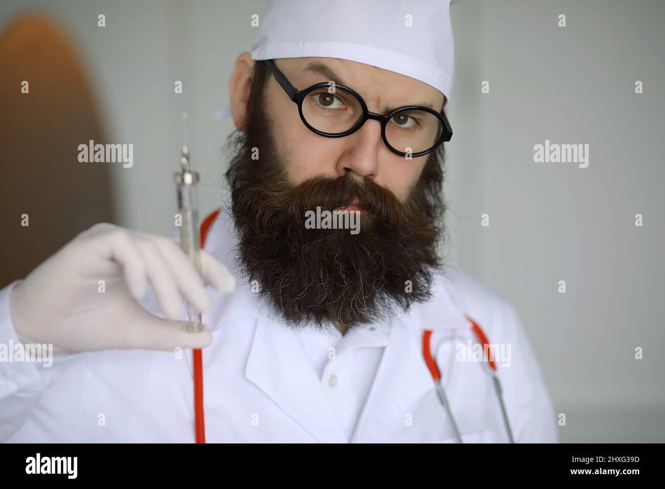 Doctor crazy. Mad beard scientist conducts experiments in a scientific ...
