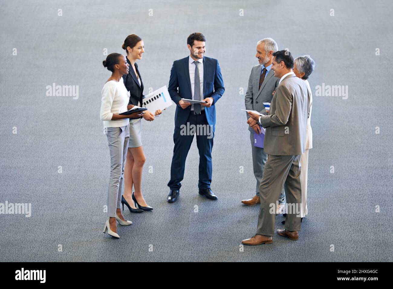A quick briefing before the meeting. High angle shot of a group of ...