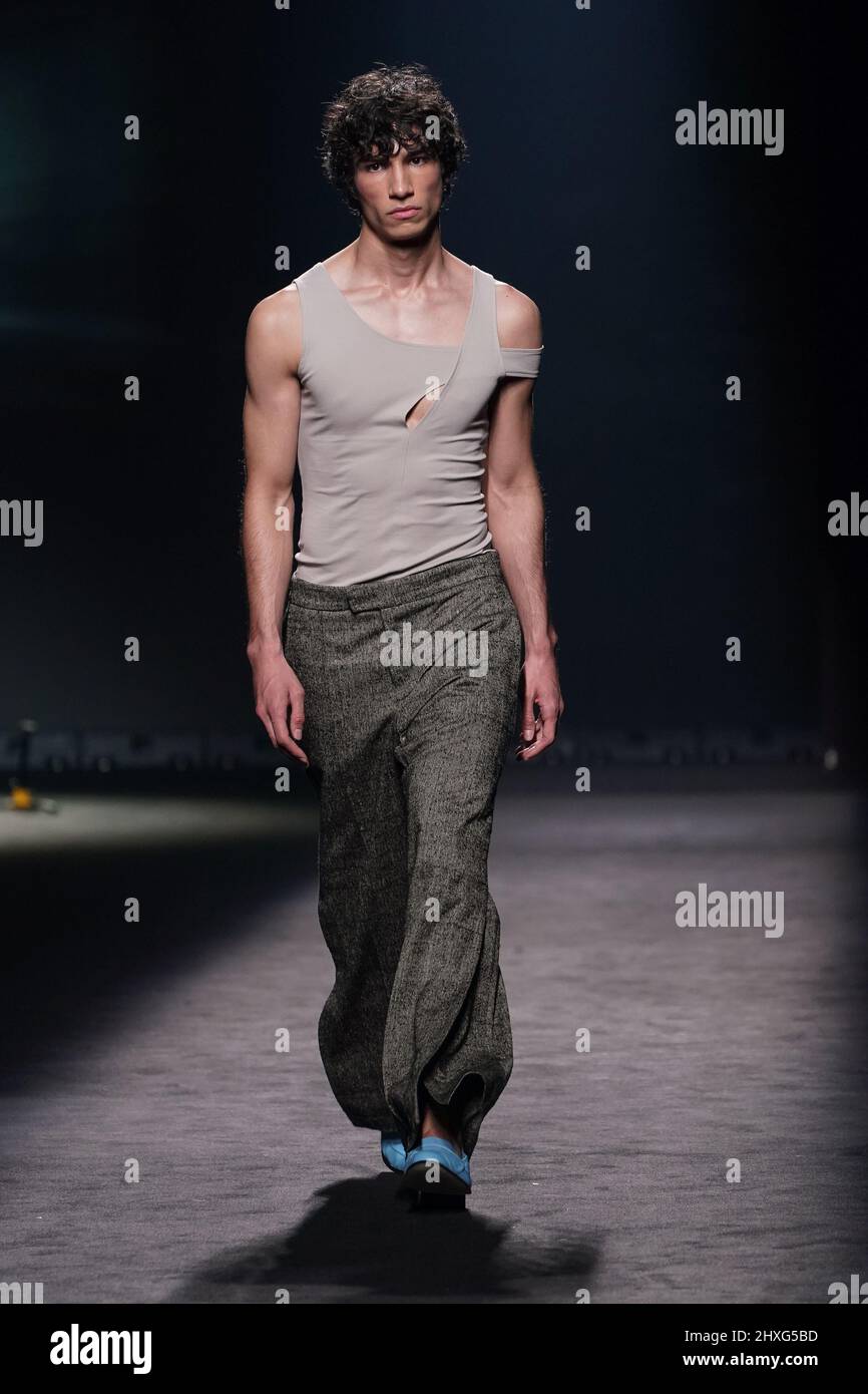 Madrid, Spain. 12th Mar, 2022. A model walks the runway at the Otrura ...