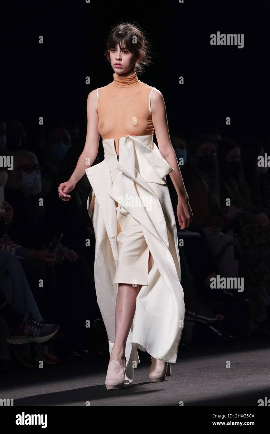 Madrid, Spain. 12th Mar, 2022. A model walks the runway at the Otrura ...