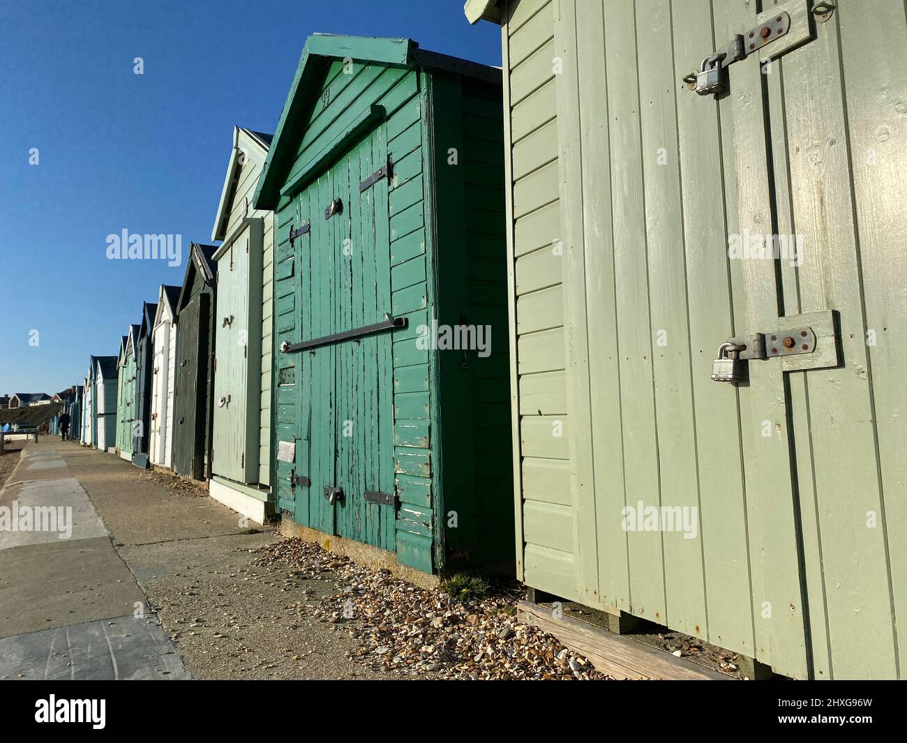 Beach huts in sunshine, Hillhead Beach, East London. Credit: Amy Deats ...