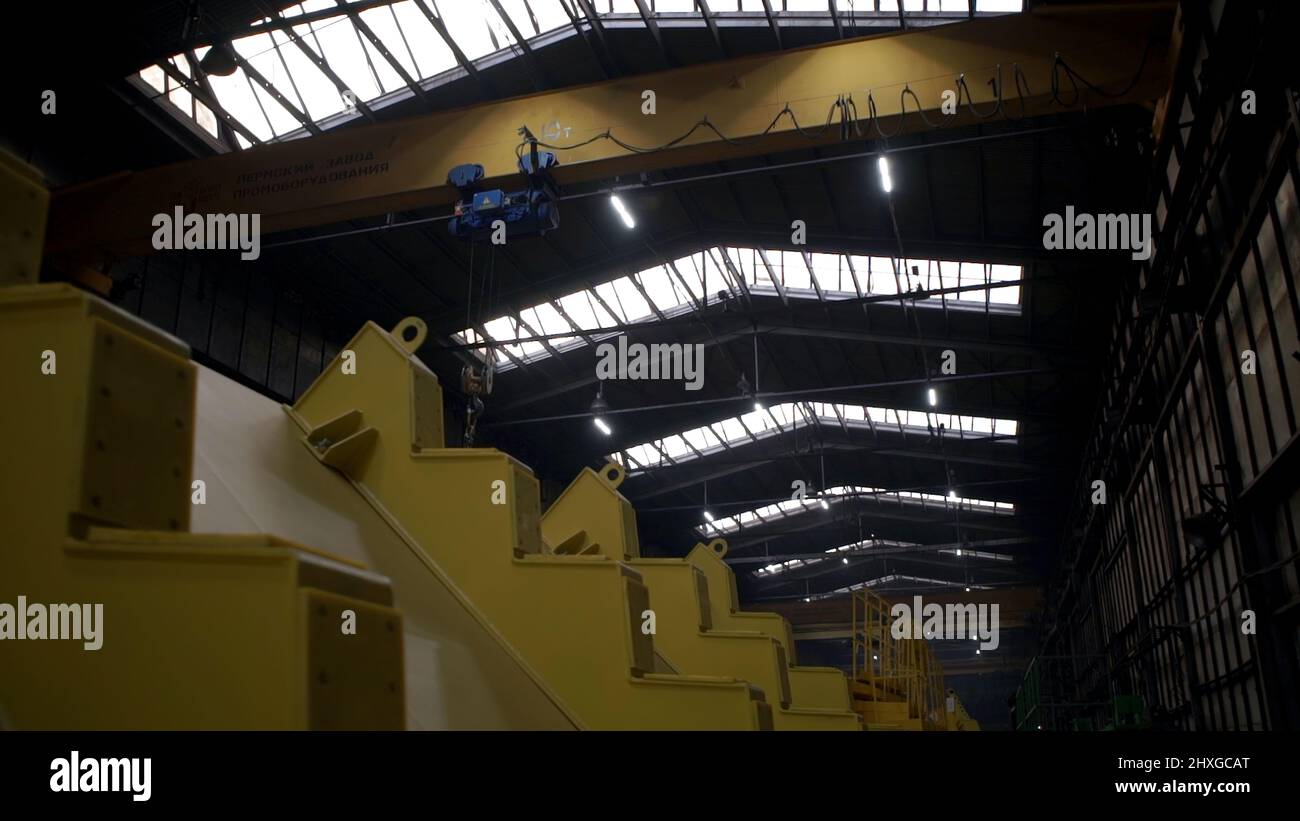 Overhead crane in production.Clip. Work at the factory with the help of ...