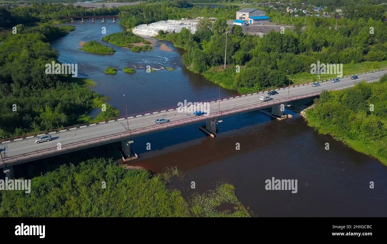 A bird's-eye view of summer. Clip. The bridge on which cars drive over ...
