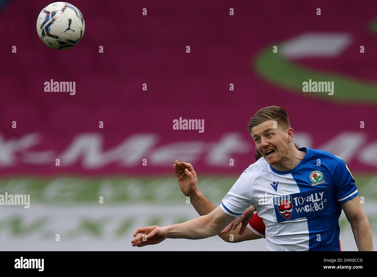 Blackburn, UK. 12th Mar, 2022. Scott Wharton of Blackburn Rovers heads ...