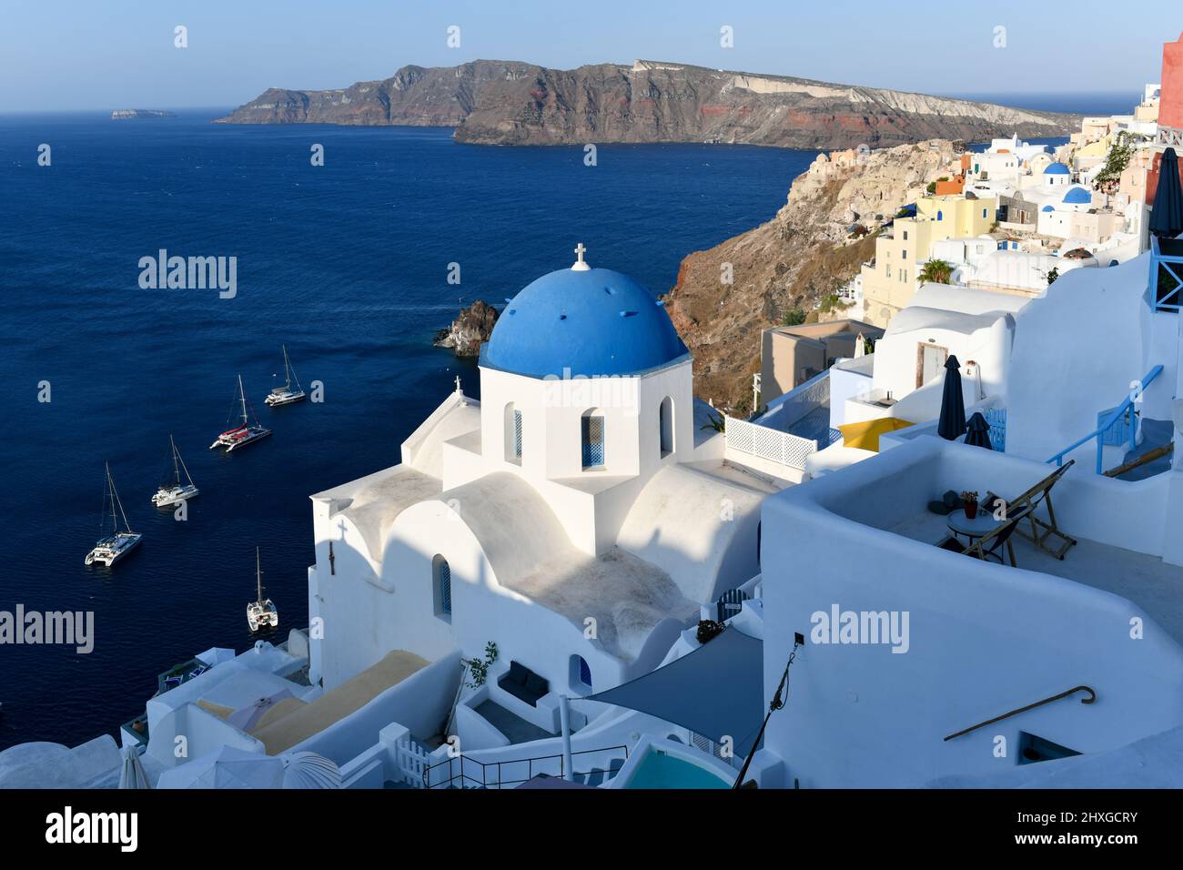 Charming view Oia village on Santorini island, Greece. Traditional ... Charming view Oia village on Santorini island, Greece. Traditional ...