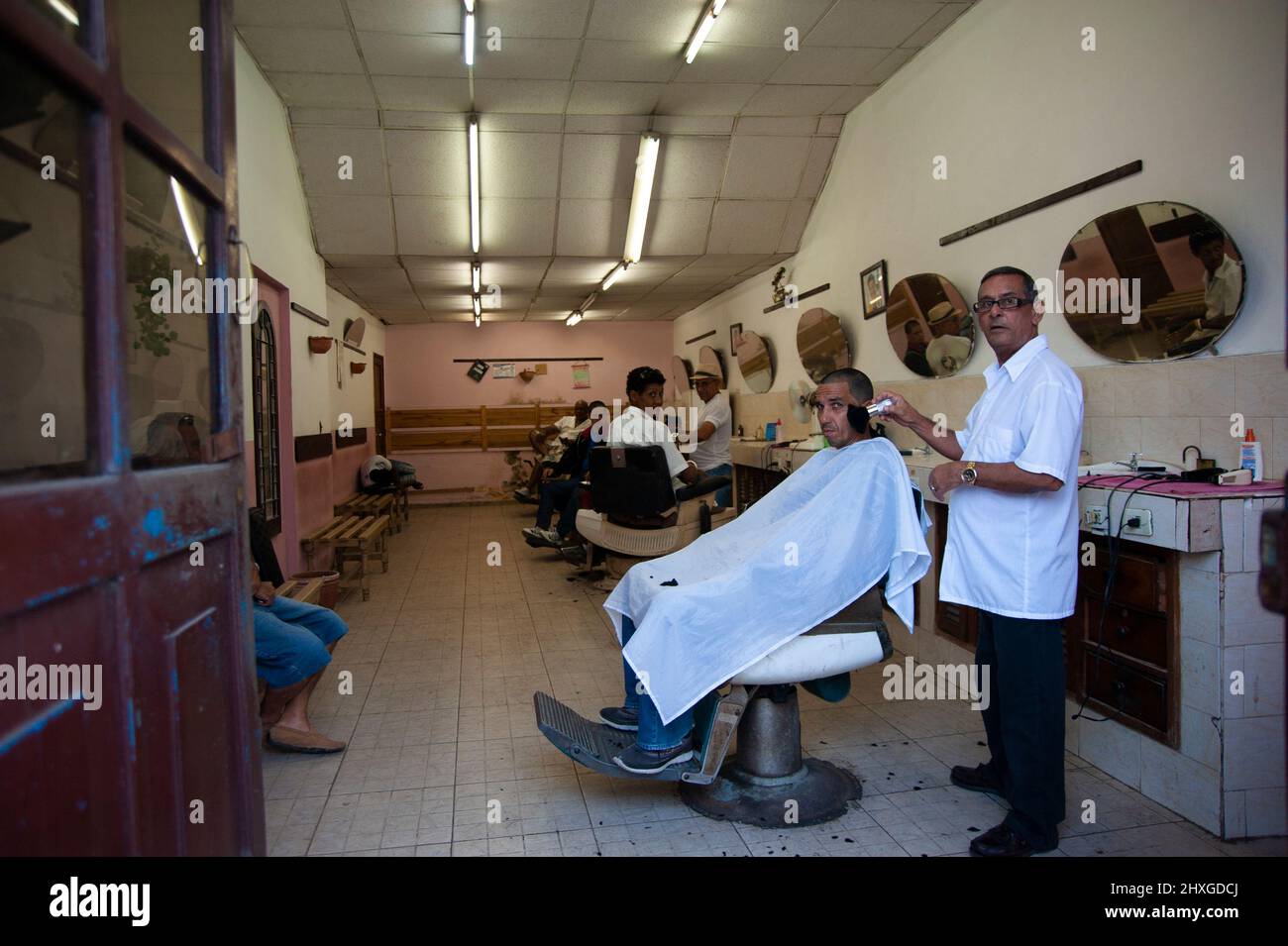Customer clientele and barber's in a barber shop in Havana, Cuba Stock ...