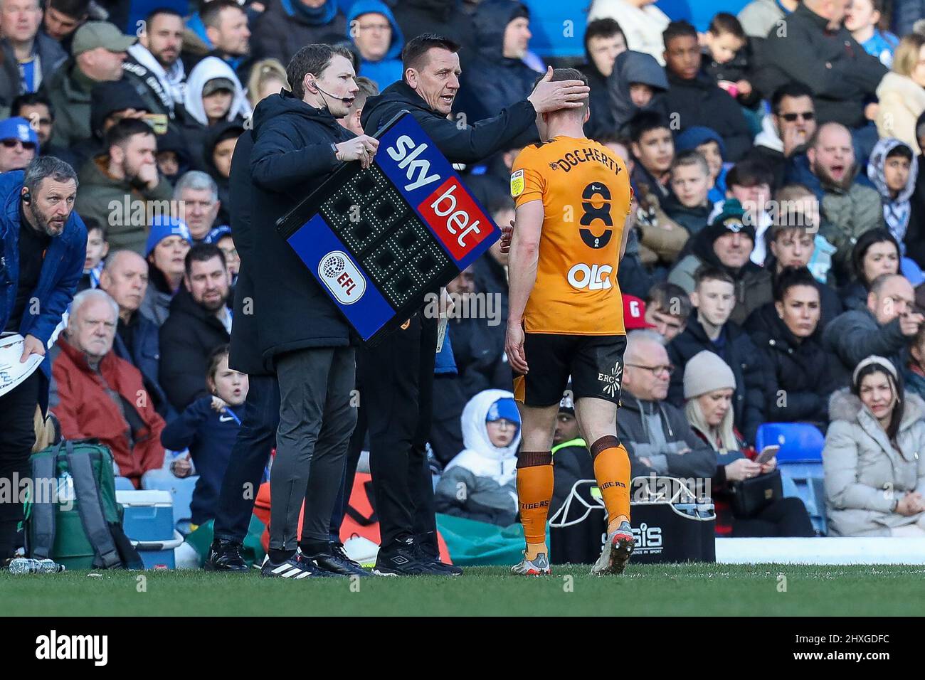 Hull City coach Tony Pennock puts his hand on Greg Docherty’s head as ...