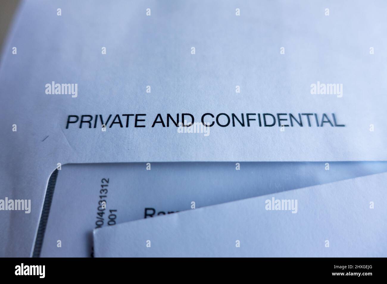 Private and Confidential above a windowed address envelope Stock Photo ...