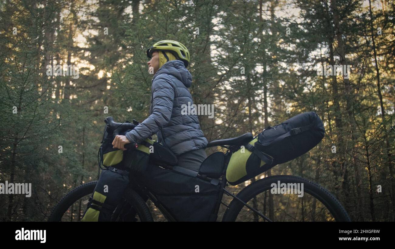 The woman travel on mixed terrain cycle touring with bike bikepacking ...