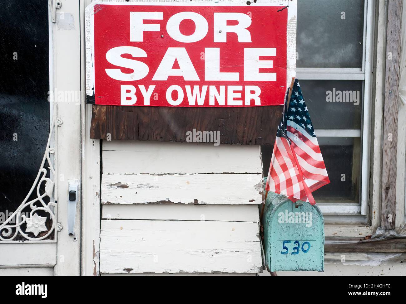For sale sign and flag Stock Photo - Alamy