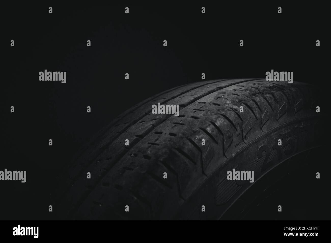 Tire from a car type truck on a black and white background with a ...