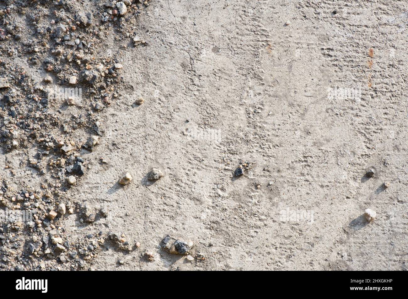 Sand and gravel on weathered concrete floor. Suitable for background ...