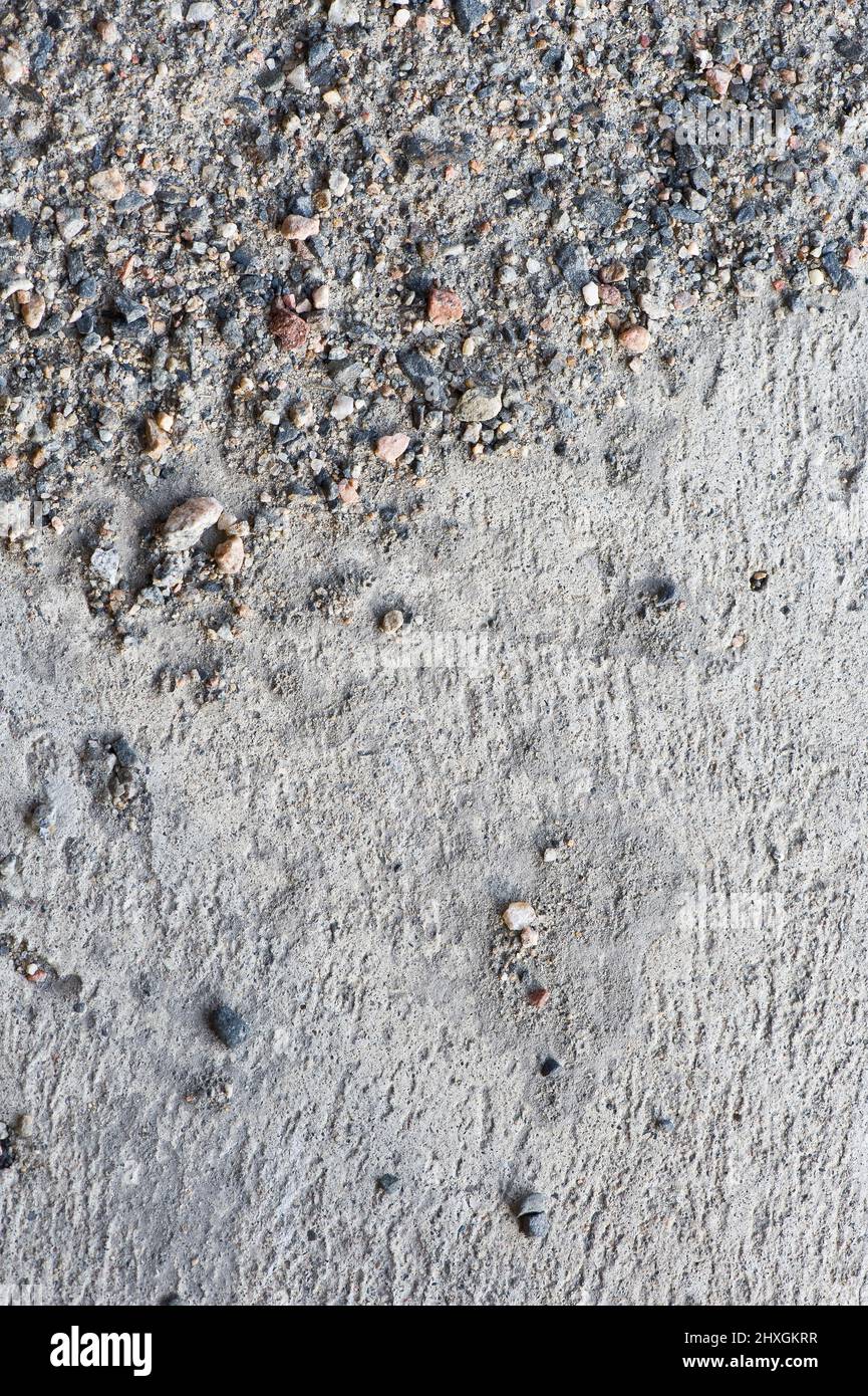Sand and gravel on weathered concrete floor. Suitable for background ...