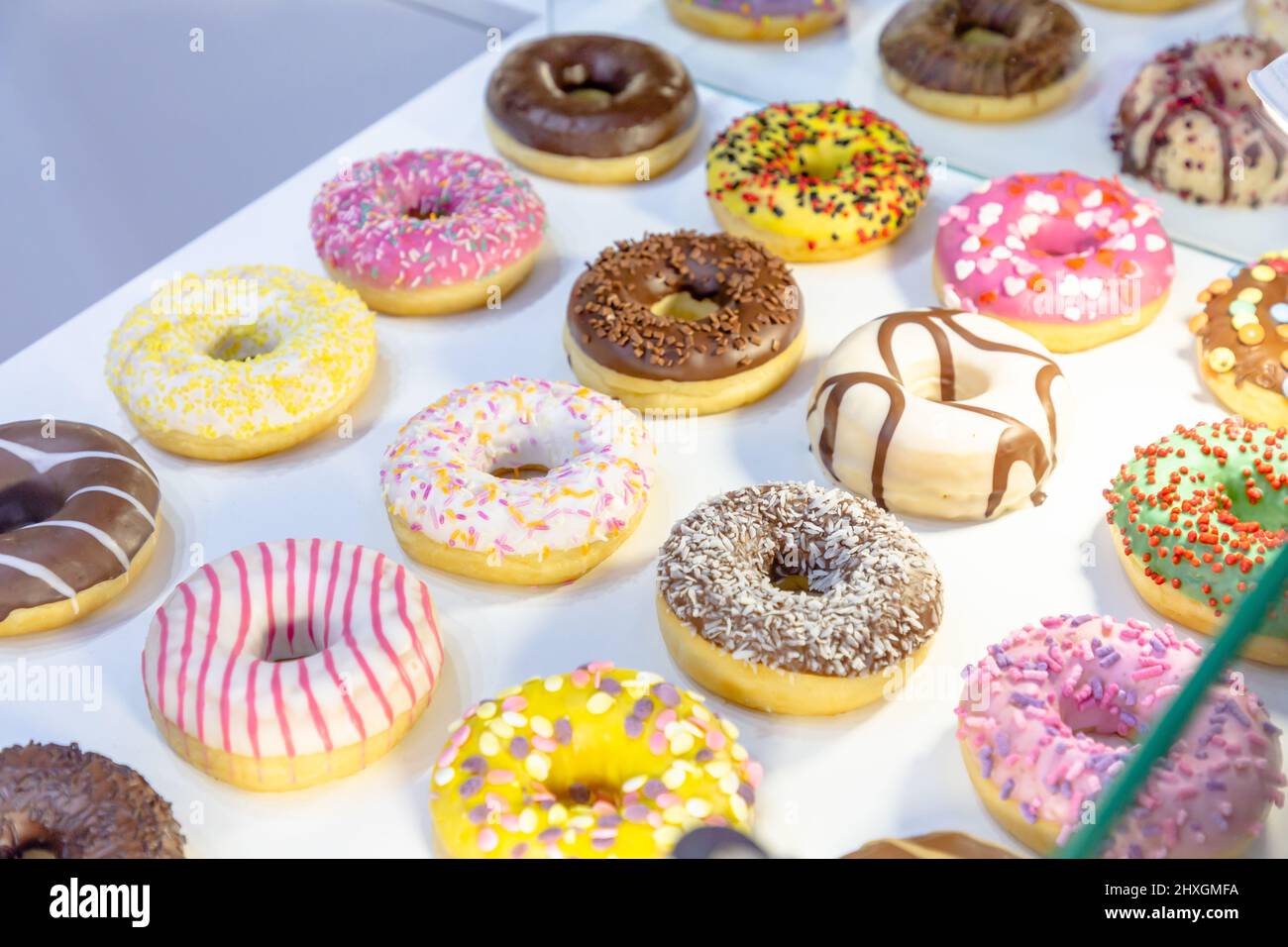 Different donuts are on display in a pastry shop Stock Photo - Alamy