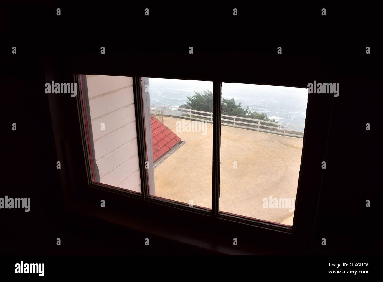 View Through 3-Paned Glass Window to Roofline, Tree and Ocean Stock ...