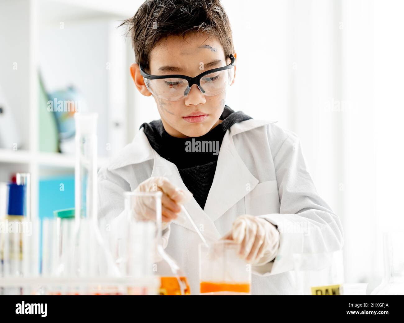 School boy in chemistry class Stock Photo - Alamy