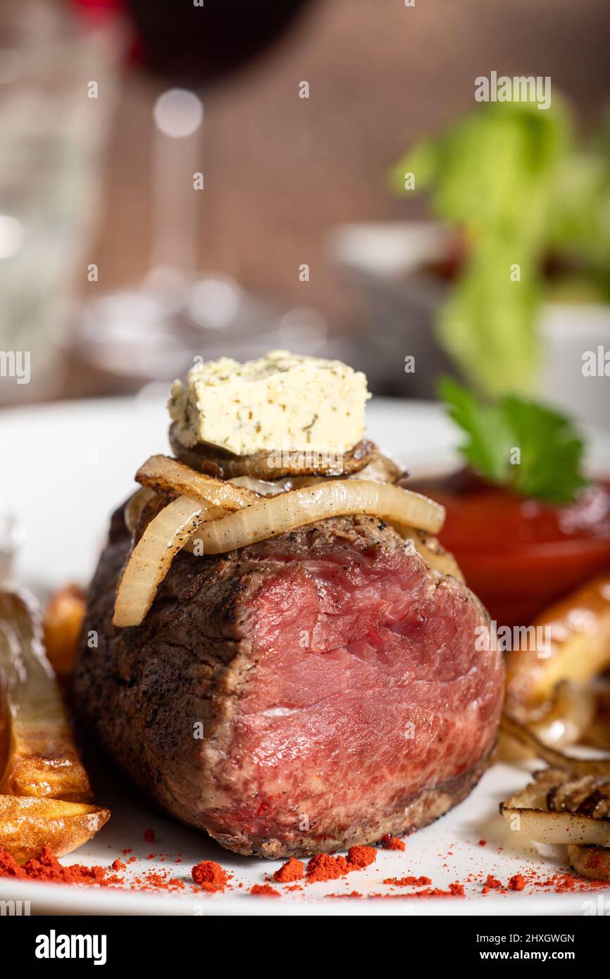 grilled steak with onion rings Stock Photo - Alamy