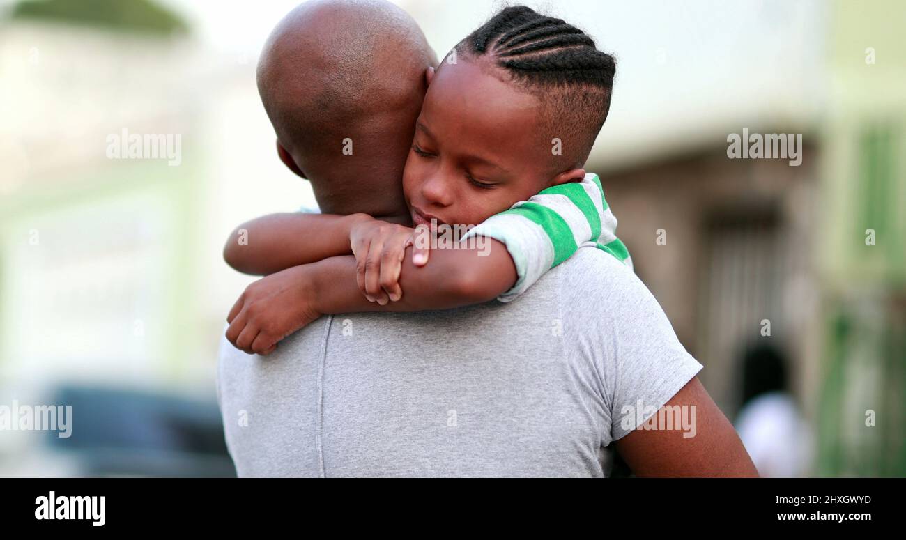African son hugging father. Black ethnicity family love and affection ...