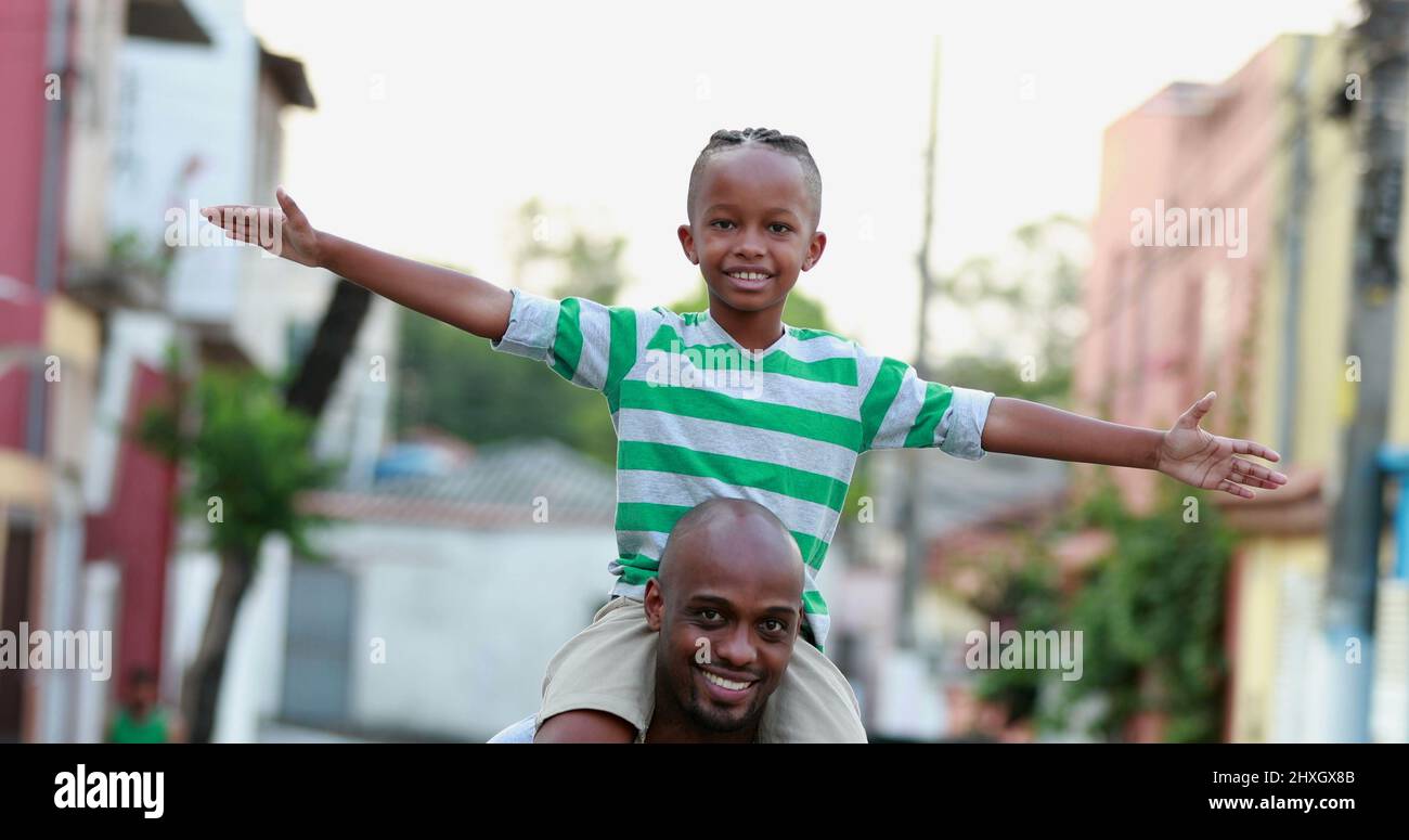 Father and son bonding relationship. Child on dad shoulders outside ...