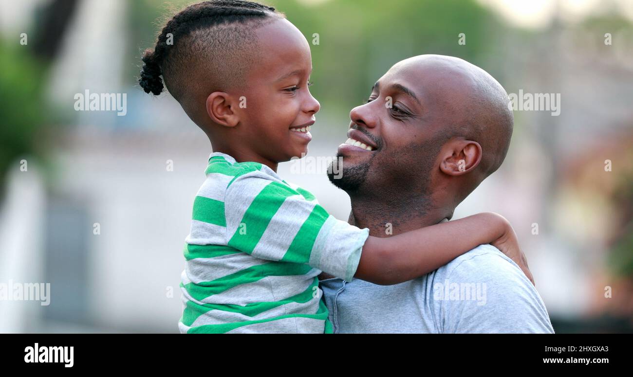 Father and son doing eskimo kiss. African black dad and child bonding ...