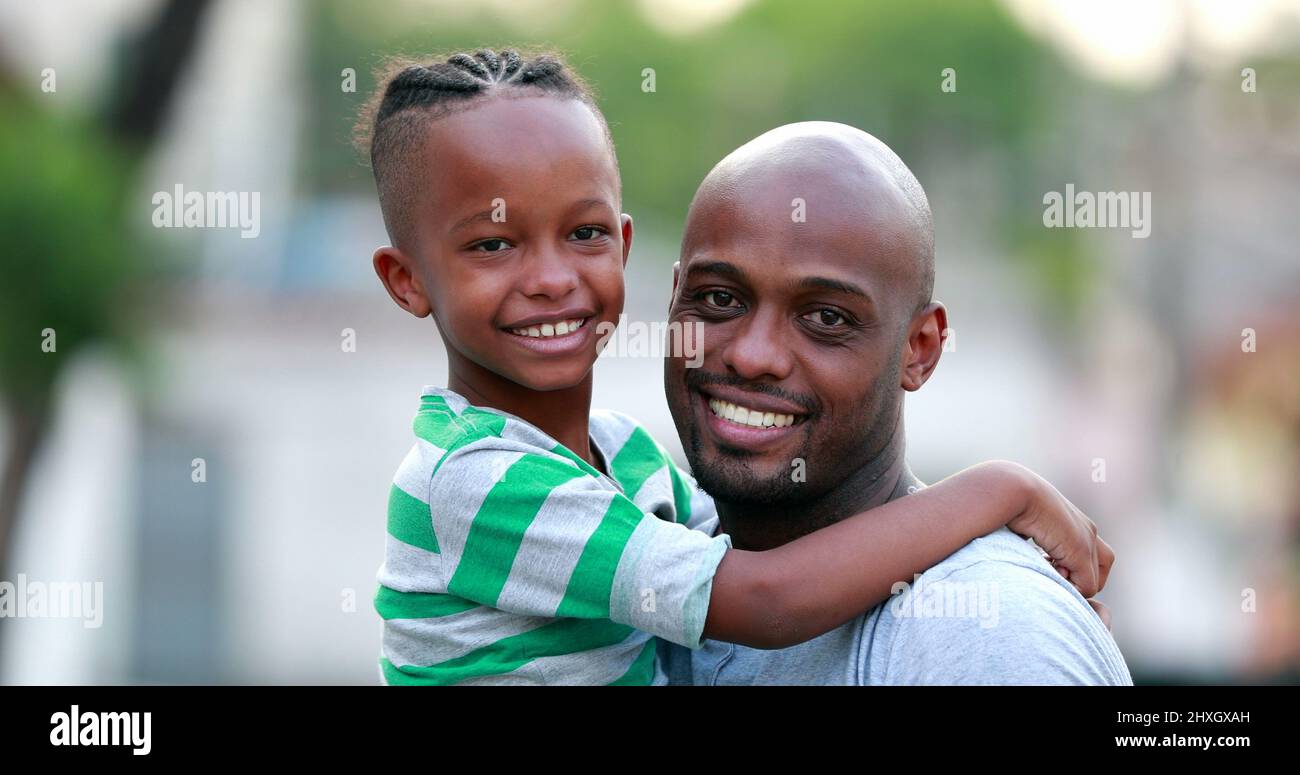 Father and son doing eskimo kiss. African black dad and child bonding ...