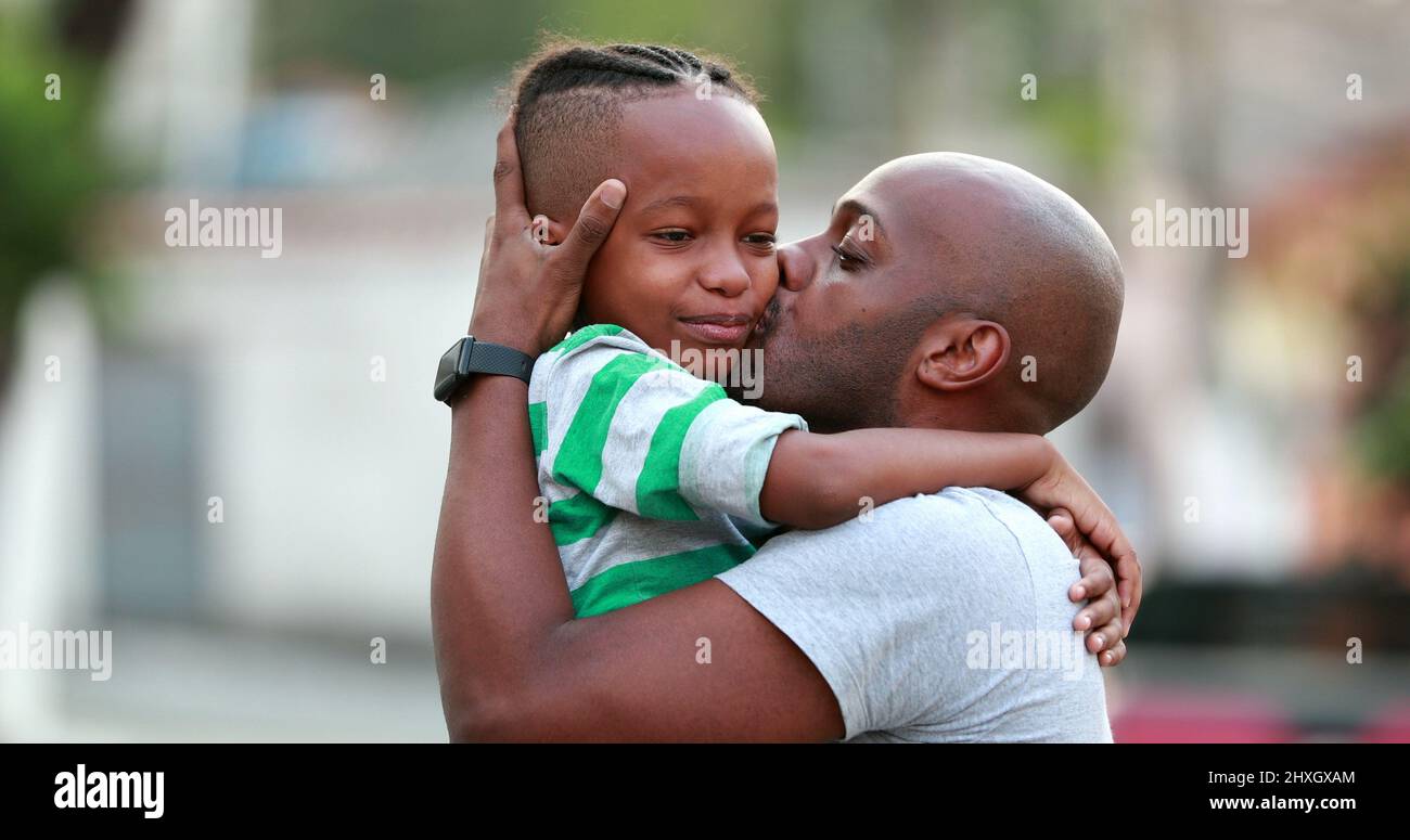 Father and son love and affection. Black African ethnicity. Dad and kid ...