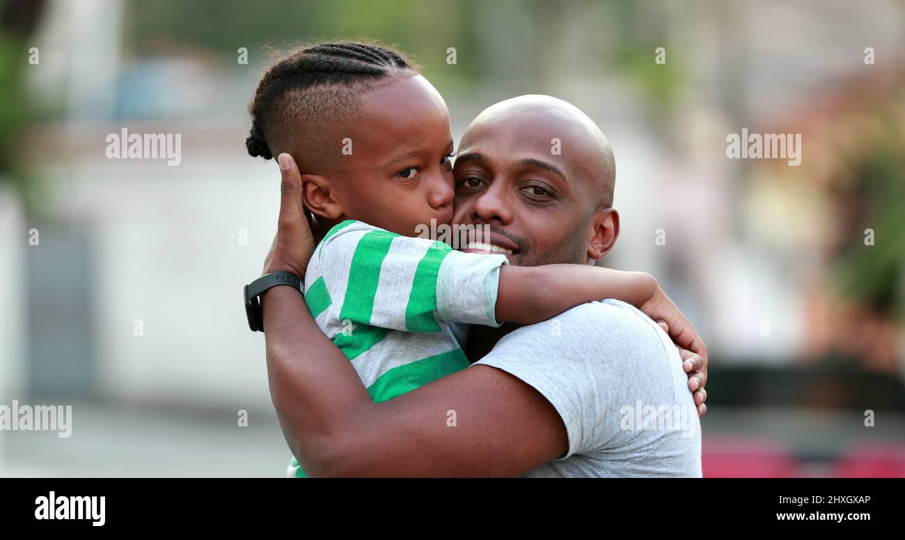 Father and son love and affection. Black African ethnicity. Dad and kid ...