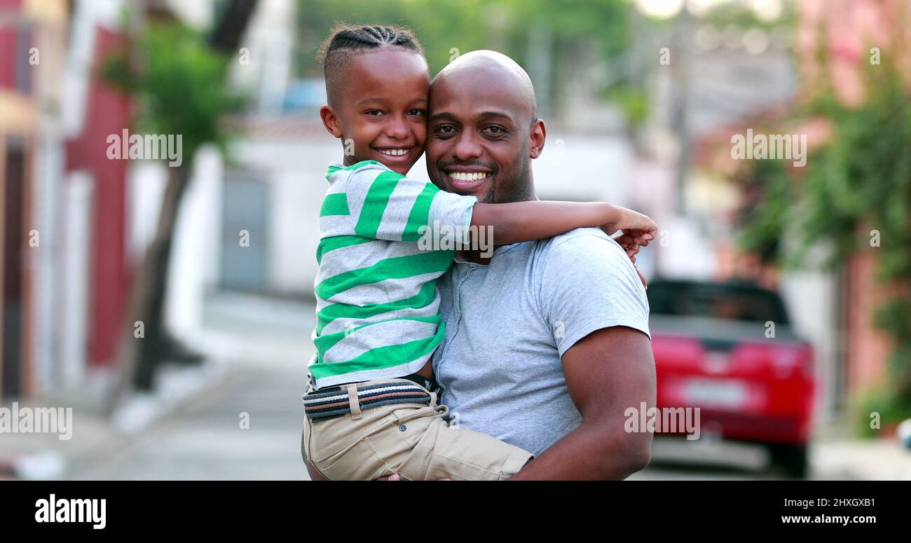 Father and son doing eskimo kiss. African black dad and child bonding ...